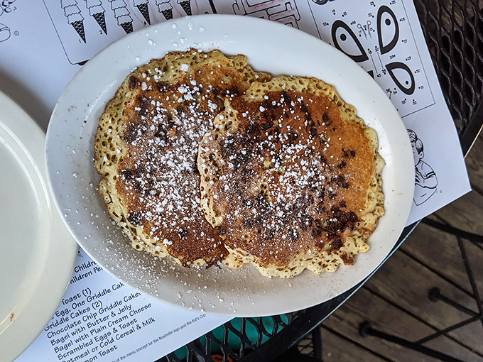 These pancakes aren't just breakfast, they're an event—dusted with powdered sugar and ready to soak up maple syrup like they were born for it.