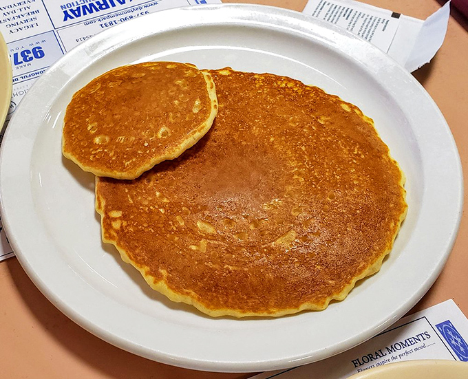 Pancakes so perfectly golden they deserve their own Instagram account. The crispy edges give way to a fluffy center that's basically a maple syrup sponge.