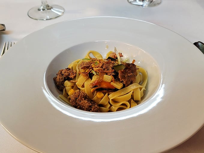 Pappardelle Bolognese with ribbons of pasta wide enough to carry your taste buds straight to Bologna. Comfort food with a PhD.