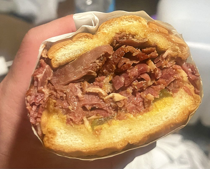 The pastrami sandwich doesn't just have meat—it has a mountain of perfectly seasoned, thinly-sliced pastrami that demands a two-handed commitment.