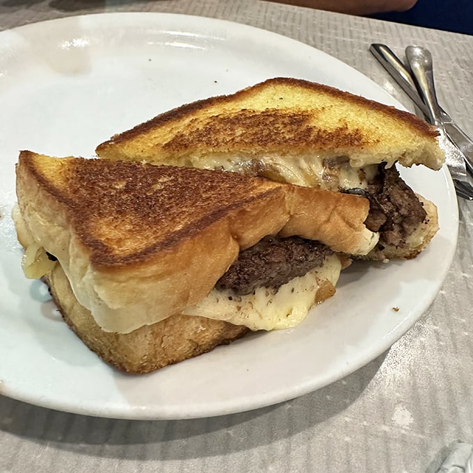 This isn't just a patty melt—it's what happens when bread, beef, and cheese have a beautiful reunion. Crispy, gooey perfection on a plate.
