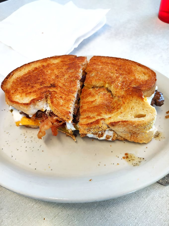 The patty melt—where burger meets sandwich in a glorious union of toasted bread, melted cheese, and beefy perfection.