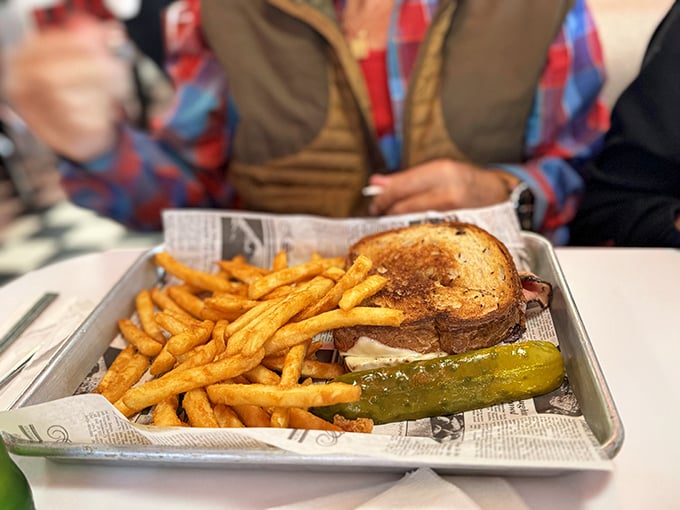 This isn't just a sandwich; it's a masterpiece of melted cheese, toasted bread, and crispy fries that would make any lunch counter proud.