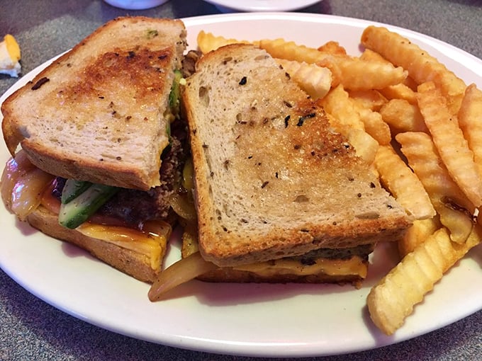 This isn’t just a patty melt; it’s architectural genius. Golden-brown toast, melty cheese, and those crinkle-cut fries deserve their own zip code.