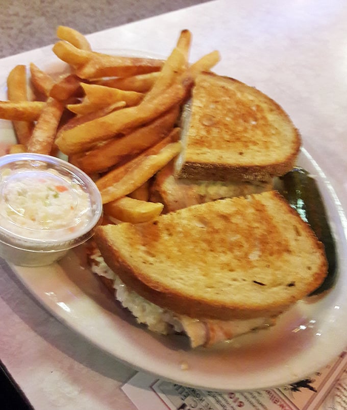 This isn't just a sandwich—it's architecture. Golden-grilled bread, melty cheese, and crispy fries create the comfort food trifecta we all crave.