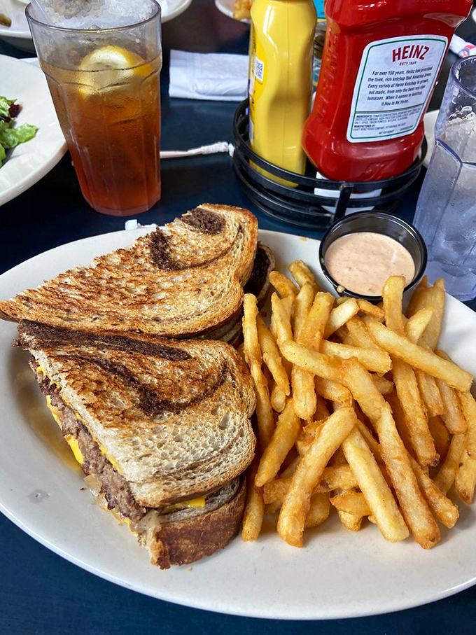 This Patty Melt isn't just grilled to perfection—it's a masterclass in sandwich architecture, with that golden-brown exterior giving way to melty, beefy bliss.