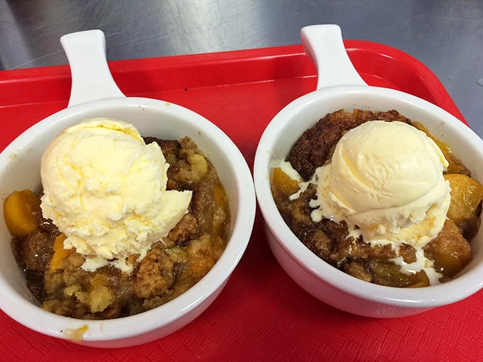 Warm peach cobbler crowned with melting vanilla ice cream—proof that Georgia's fruit can find its highest calling in dessert form.