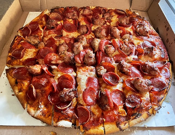 Pepperoni that curls into little flavor cups and sausage that's clearly homemade—this pizza doesn't need a passport to transport you to Italy.