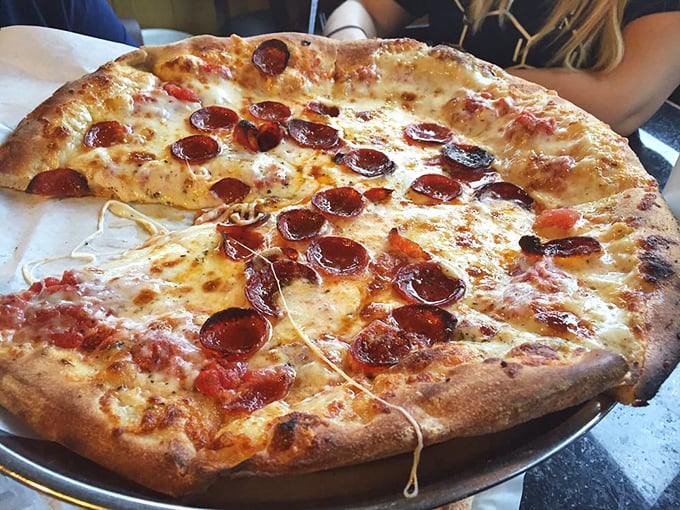 This pepperoni pizza doesn't just have cheese pulls – it has cheese symphonies, with those perfectly crisped pepperoni cups holding tiny pools of flavor.