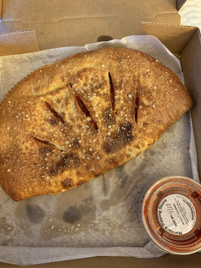 The calzone: pizza's mysterious cousin that keeps all the good stuff hidden inside like a delicious secret waiting to be revealed.
