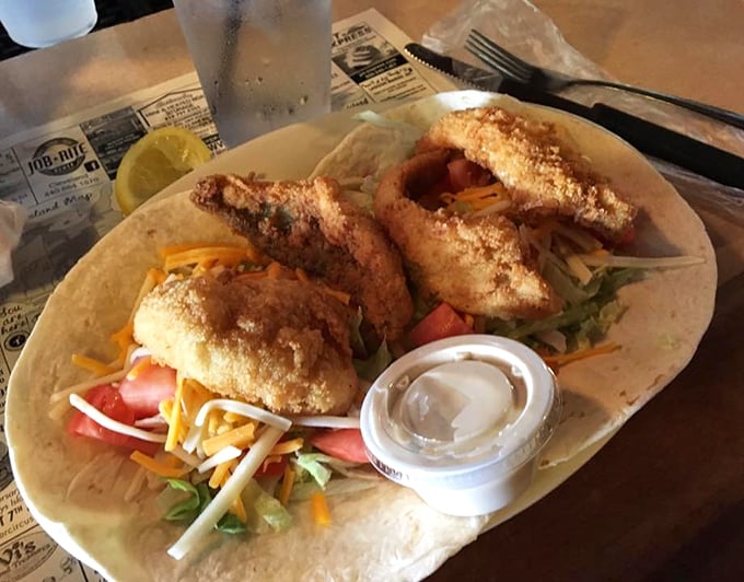 Perch tacos – because sometimes even perfection can be improved by wrapping it in a tortilla with fresh veggies and a dollop of creamy sauce.