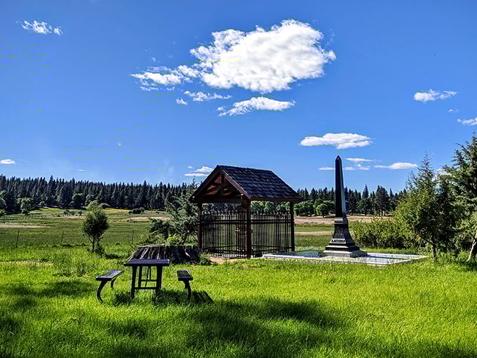 A peaceful memorial site with picnic table included—because contemplating history works up an appetite in mountain country.