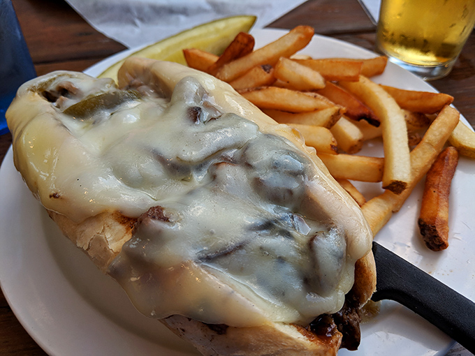 Melted cheese cascades over thinly sliced steak like a dairy waterfall of dreams. The Philly at Piper's doesn't just satisfy hunger—it creates devotion.