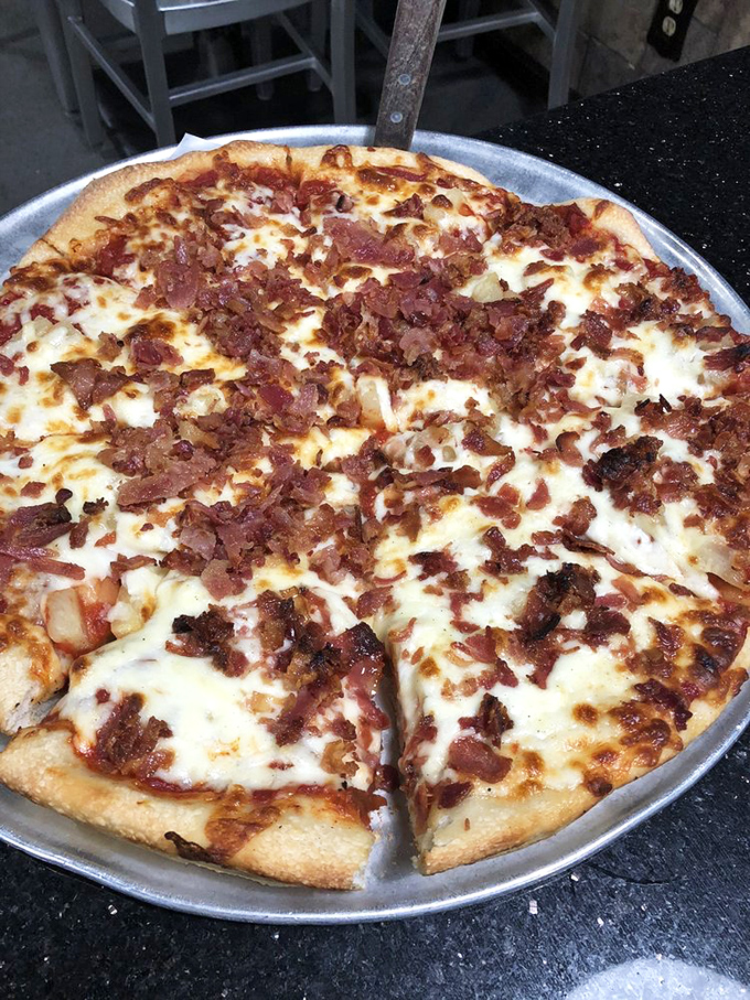 Pizza perfection doesn't need fancy toppings. This bacon-loaded pie proves that sometimes the classics, done exceptionally well, are all you need in life.
