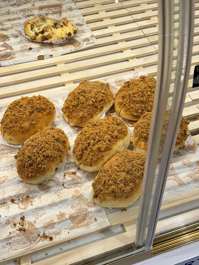 These pork buns with their golden-brown crumble topping are what carb dreams are made of—pillowy, savory, and utterly irresistible.