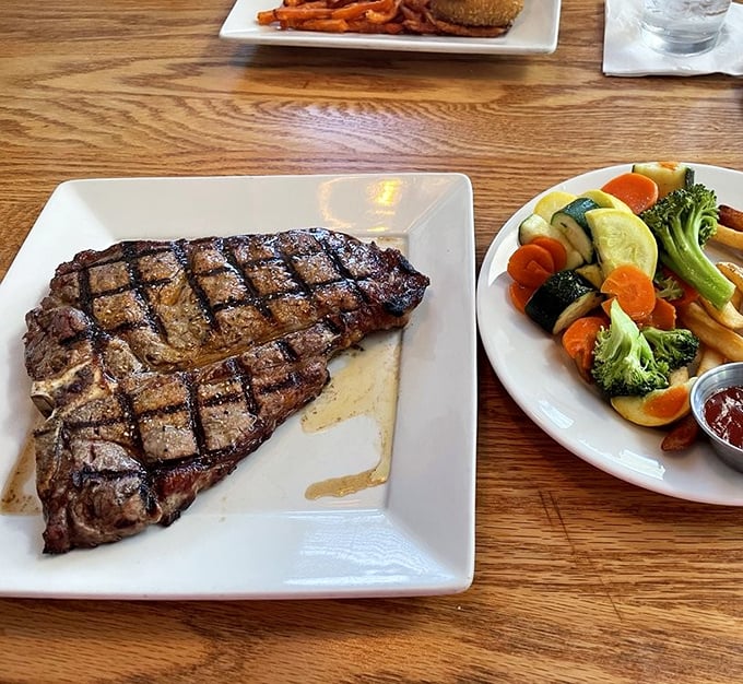 The grill marks on this steak aren't just decoration—they're the autograph of a chef who understands that simplicity and quality trump culinary gymnastics.