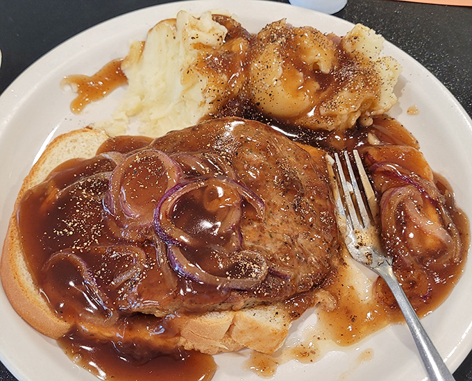 This isn't just pot roast—it's therapy on a plate. The gravy has that glossy richness that says "I've been simmering for hours just waiting for you."