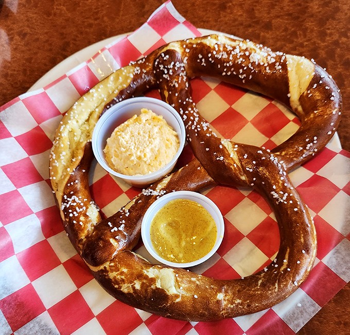 This isn't just a pretzel—it's architectural genius with salt crystals, served with dips that make you question all other pretzel experiences.