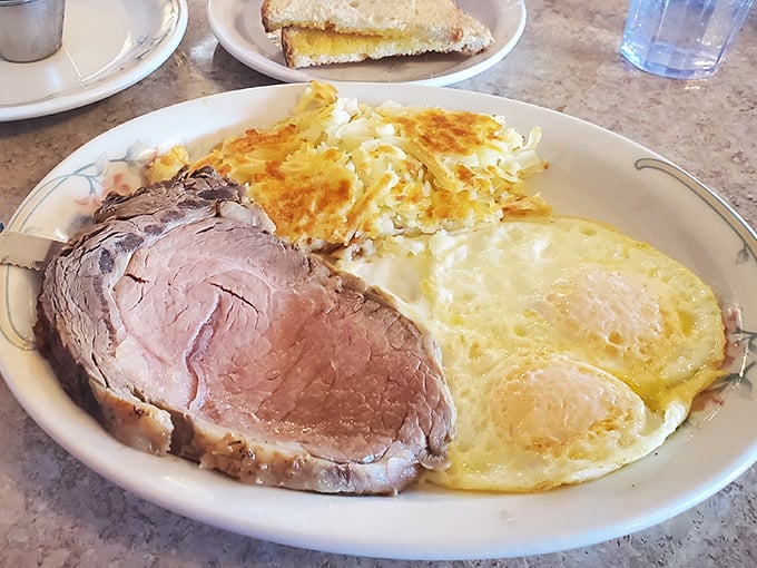 Prime rib cooked to perfection alongside sunny-side-up eggs—proof that sometimes the simple things in life are the most extraordinary. 