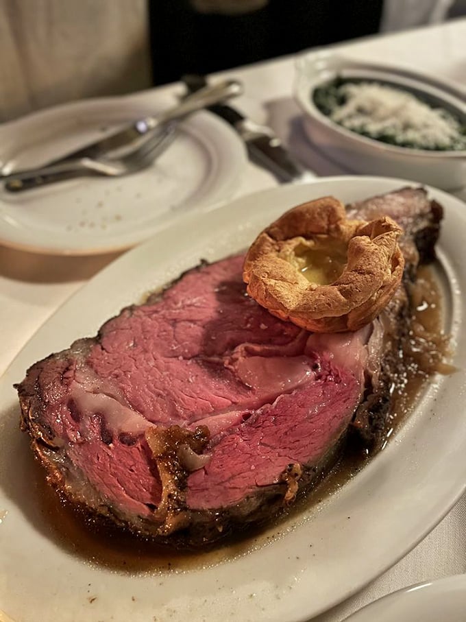 Prime rib that makes you understand why cavemen discovered fire – tender, pink, and crowned with a Yorkshire pudding halo.