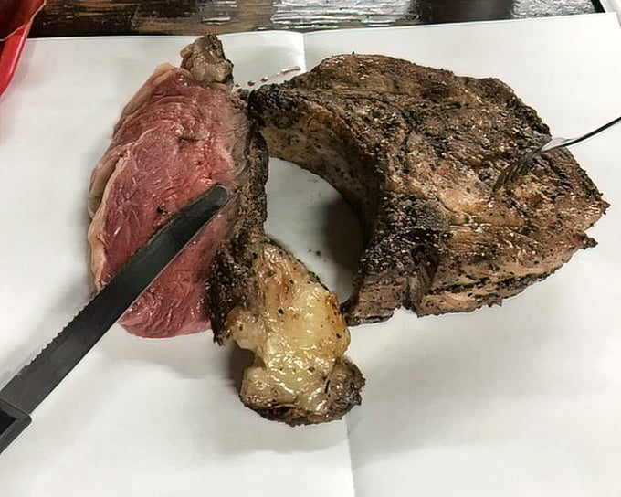 The prime rib and pork chop at Cooper's aren't just cuts of meat—they're edible monuments to Texas excess and perfection.