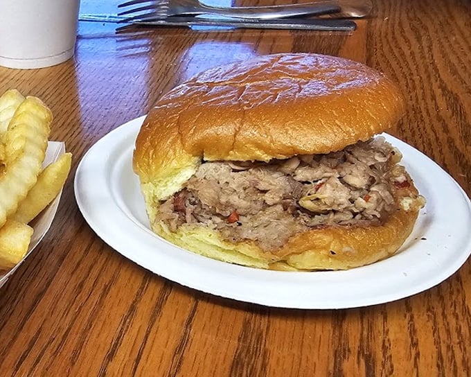 The sandwich that stops conversations mid-sentence. Tender pulled pork on a pillowy bun—simplicity that reaches transcendence.