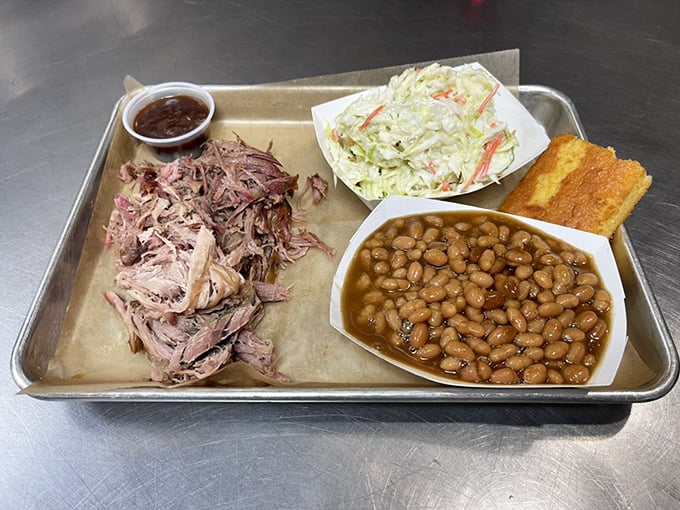 Pulled pork that's had a proper introduction to smoke and time. Paired with creamy slaw and beans, it's the holy trinity of barbecue bliss.