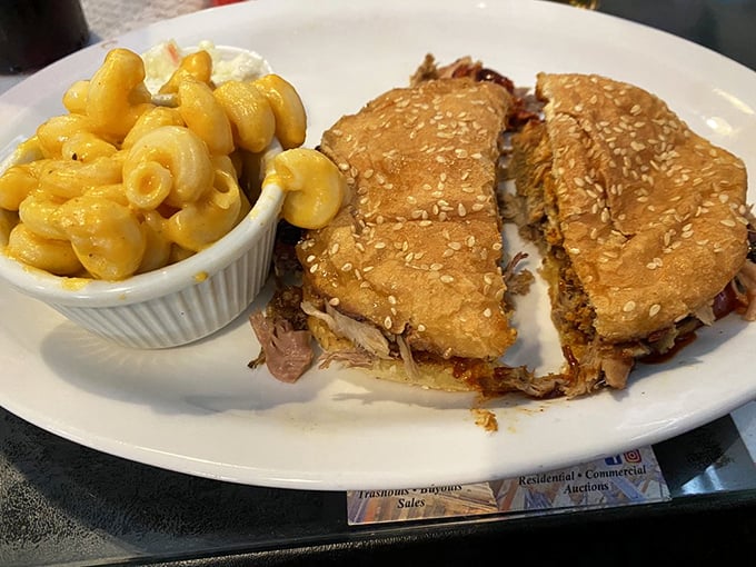 This pulled pork sandwich with mac and cheese isn't just lunch – it's a commitment to excellence that requires both hands and several napkins.