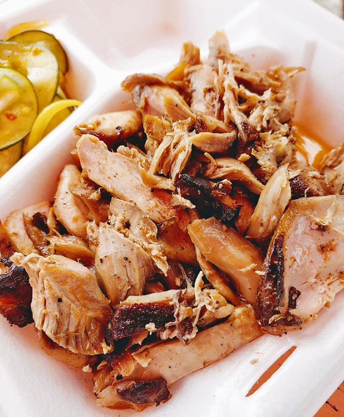 Pulled chicken that makes you question why you ever bothered with other proteins. Those pickle slices aren't just garnish—they're essential supporting actors.