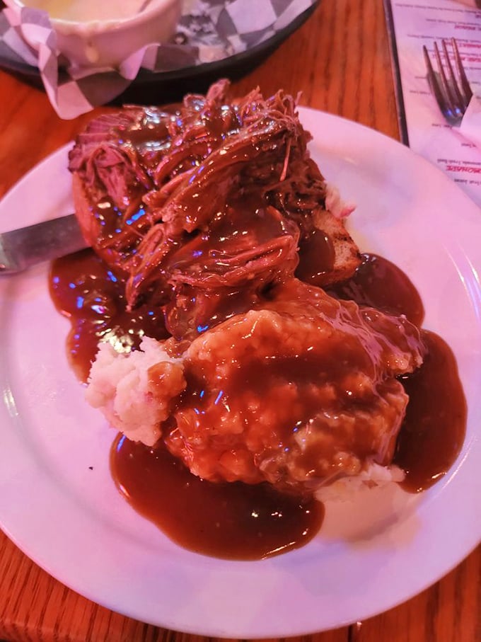 Pulled pork so tender it practically surrendered to the fork before you even picked it up, crowned with a sauce worth bottling.