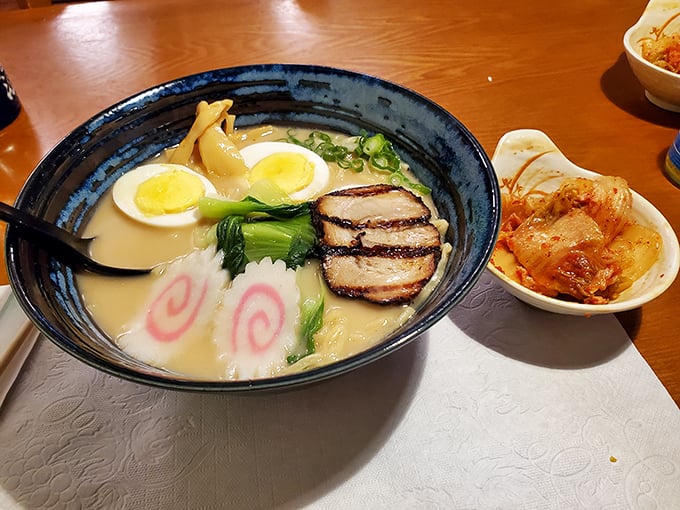 This ramen bowl isn't just soup—it's a swimming pool of comfort with those playful pink swirls, tender pork, and an egg that's achieved celebrity status in the yolk world.