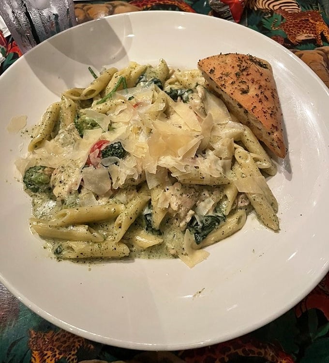 Pasta that would make both Italian grandmothers and Caribbean chefs nod in approval – creamy, herbaceous, and paired with perfectly grilled salmon.