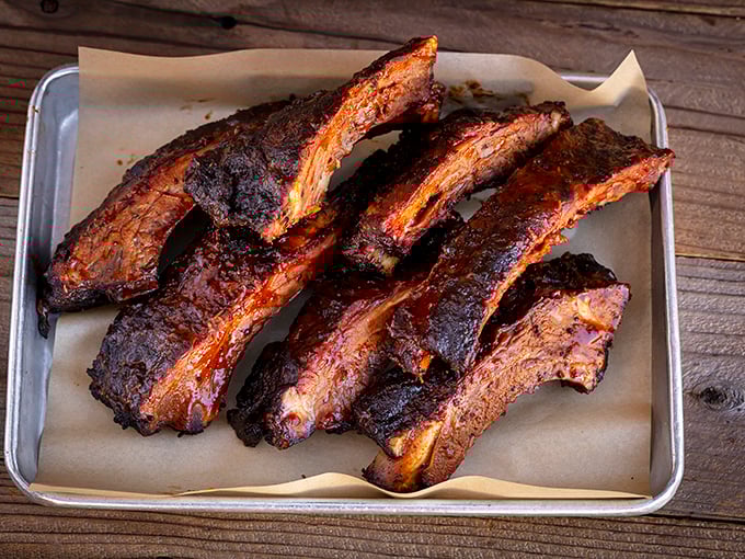 These ribs have the kind of bark that doesn't bite—unless you count the explosion of flavor. Carnivore candy at its finest.