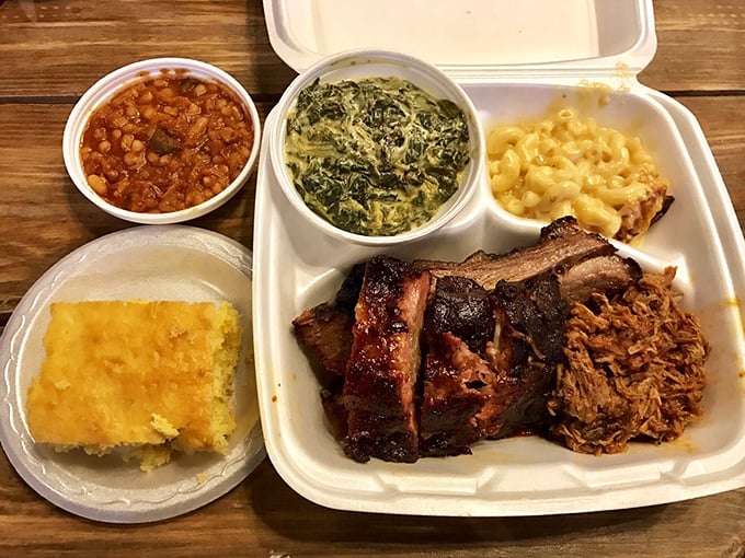 BBQ perfection on display: tender ribs with that telltale smoke ring, pulled pork, and sides that refuse to be overshadowed.