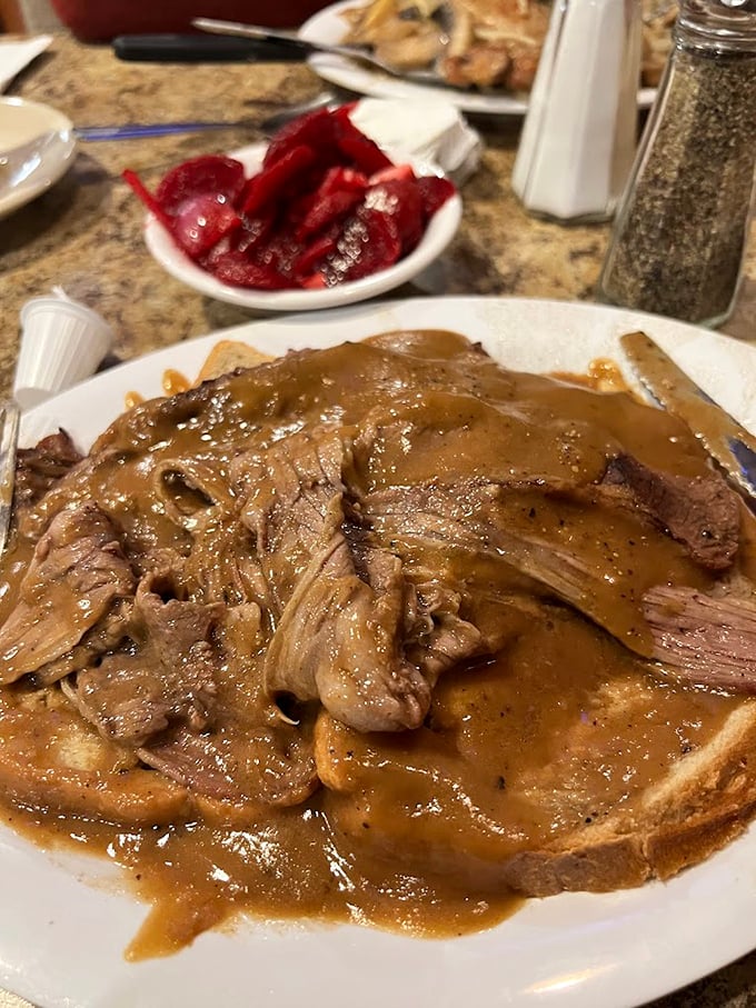 This isn't just roast beef – it's a gravy-laden love letter to comfort food that whispers, "Diet? What diet?"
