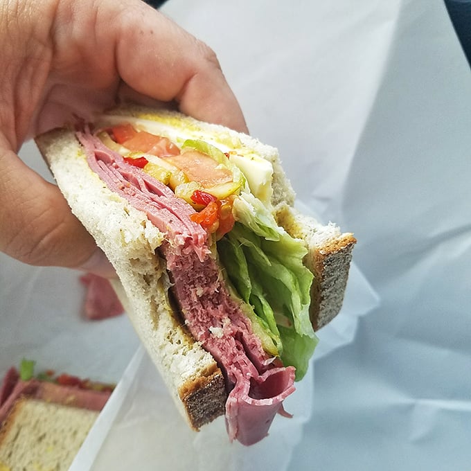 Holding this sandwich is like cradling a newborn, except it's socially acceptable to immediately devour it with reckless abandon.