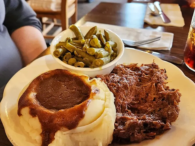Mashed potatoes swimming in rich gravy alongside tender roast beef and green beans. Grandma would approve—and possibly get jealous.