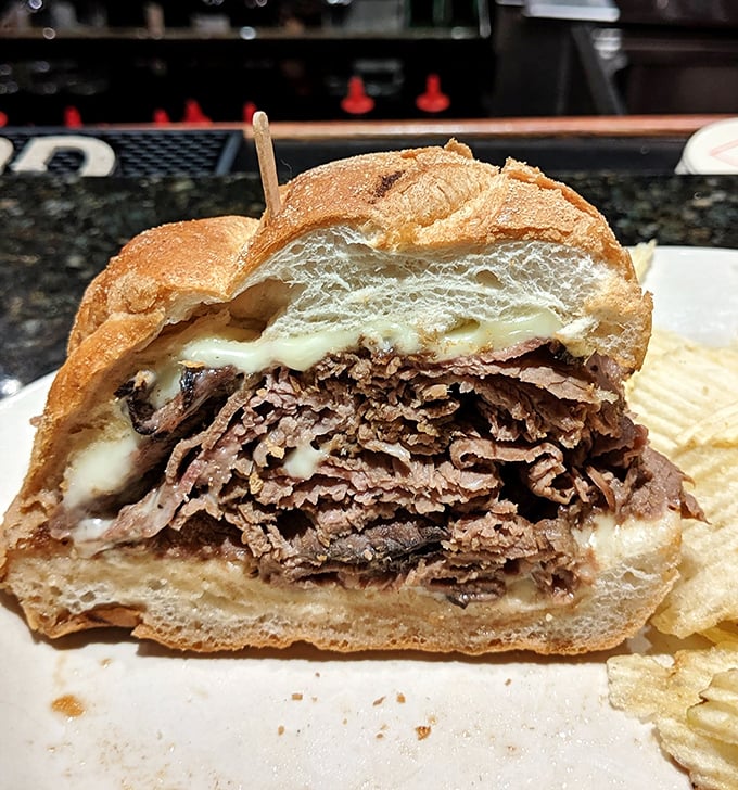 This isn't just a sandwich—it's an engineering marvel of thinly sliced roast beef. The bread is merely the delivery system for this meaty masterpiece.