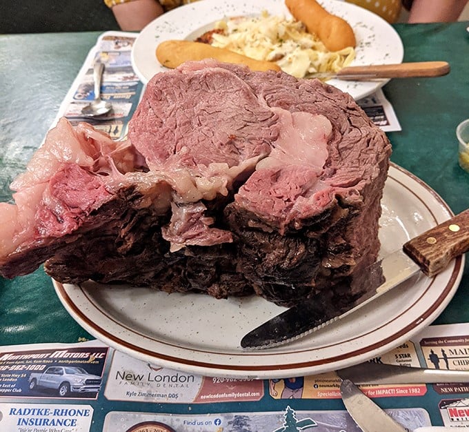 The king of Wisconsin supper club cuts in all its glory—a mountain of roast beef so substantial it could have its own ZIP code.