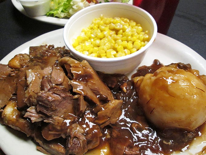 This isn't just roast beef—it's a Sunday dinner flashback, swimming in gravy deep enough to require a lifeguard on duty.