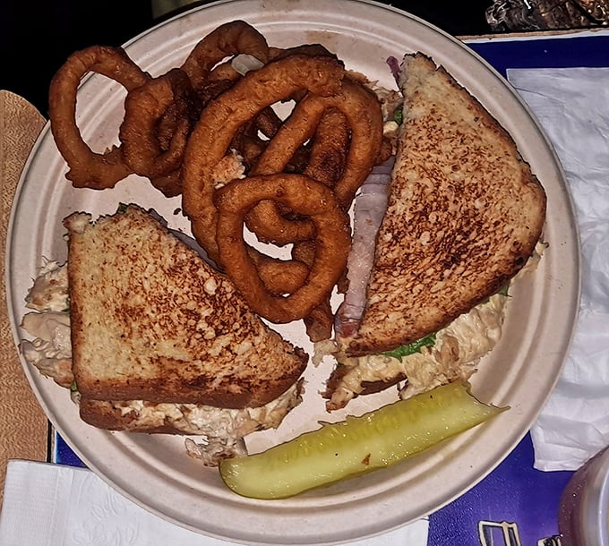 The tuna melt brings its A-game with golden-brown toast and a generous filling. That pickle isn't just garnish—it's necessary balance.