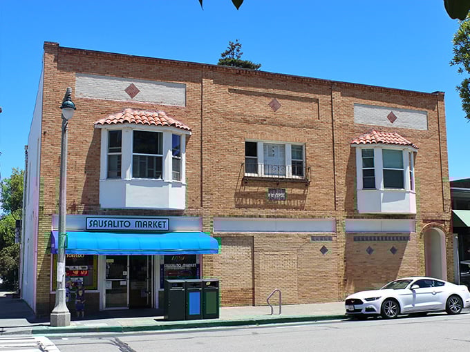 The Sausalito Market's brick façade and distinctive bay windows harken back to simpler times, when neighborhood grocers knew your name and your favorite sandwich.