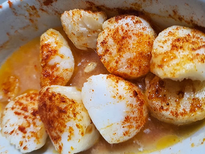 Scallops so perfectly seared they deserve their own Instagram account. That golden-brown crust is what seafood dreams are made of.