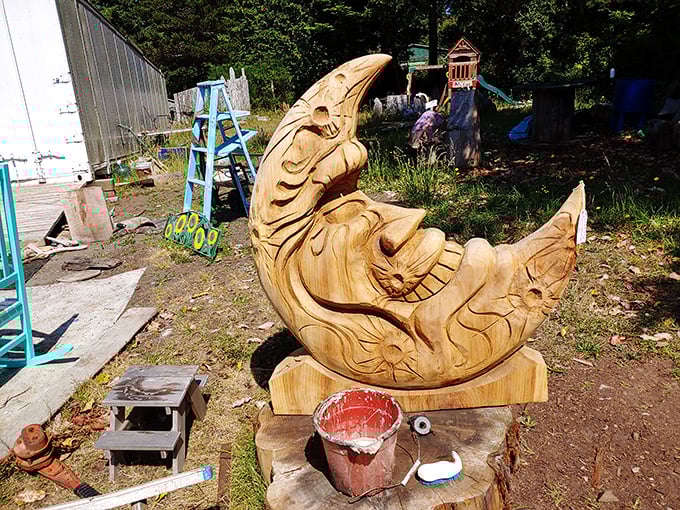 This natural wood moon cradles a sleeping figure, proving that even in the realm of fantasy art, everyone needs a good nap.