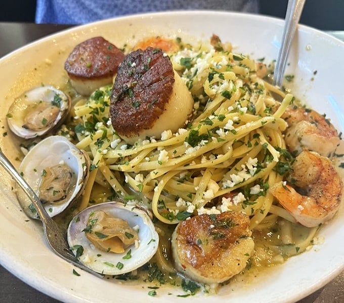 Seafood linguine that would make an Italian grandmother nod in approval – perfectly seared scallops, tender clams, and al dente pasta.
