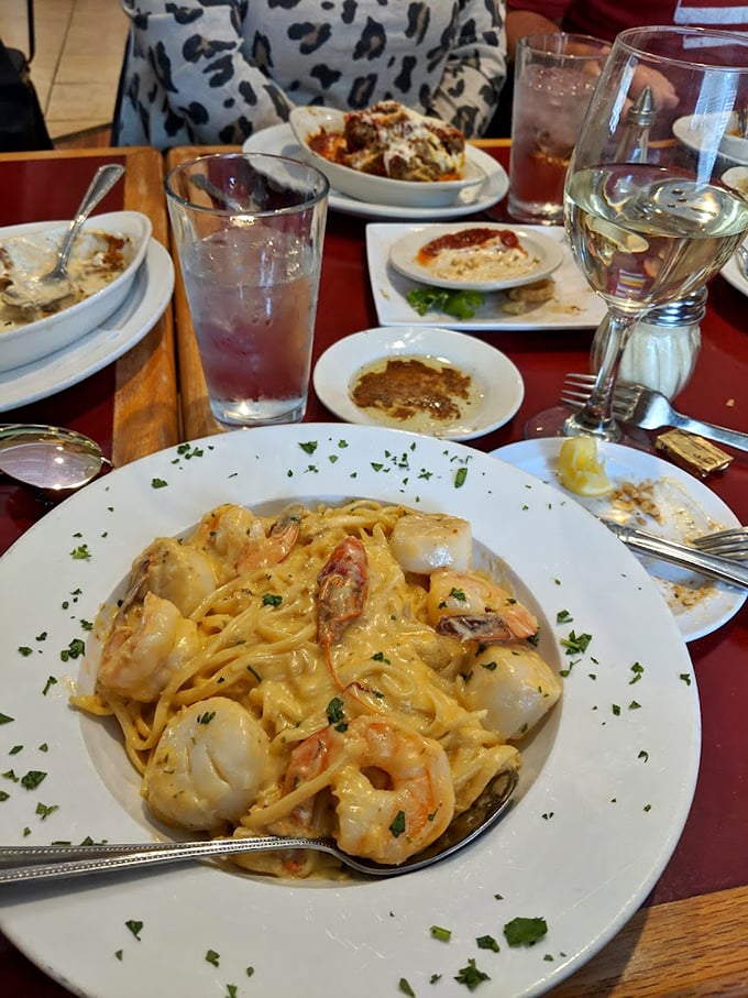 This seafood linguine isn't just pasta—it's an ocean symphony with plump shrimp nestled in creamy sauce, garnished with fresh herbs.
