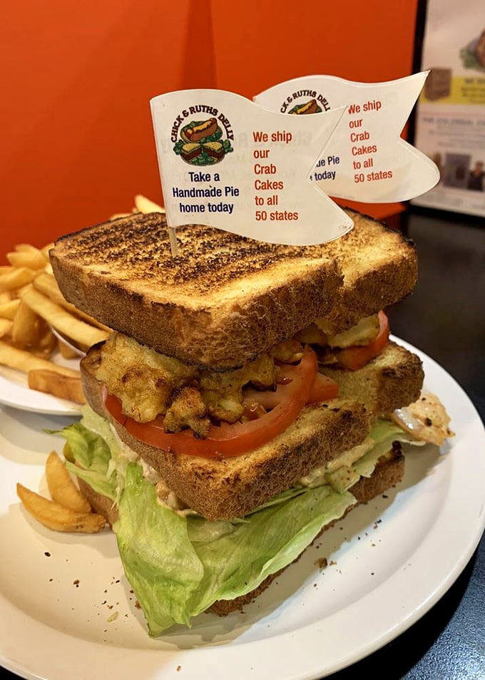 The sandwich flag says it all—these crab cakes travel to all 50 states, but they're best enjoyed right here where the Chesapeake meets Main Street.