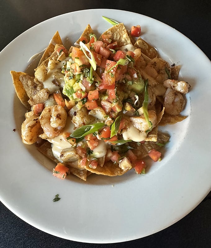 These seafood nachos aren't just appetizers—they're a fiesta where shrimp and fresh salsa dance across crispy tortilla chips.