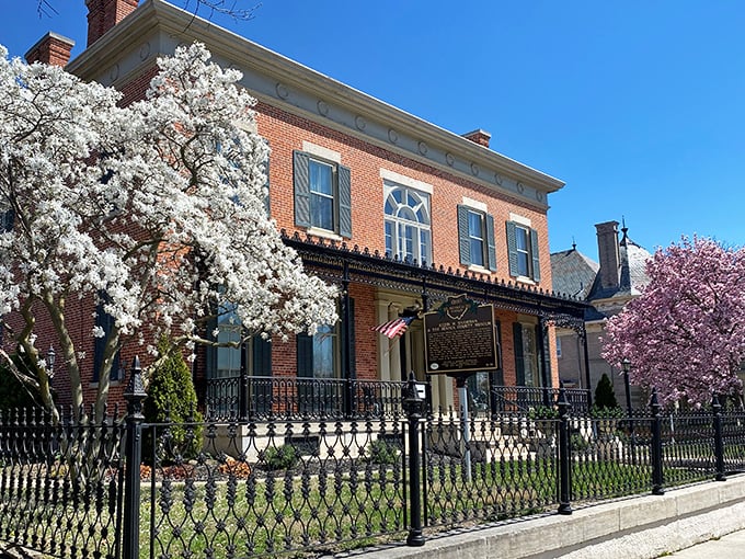 This historic home, framed by flowering trees, isn't roped off in some museum – it's part of Tiffin's living architectural heritage that makes every spring spectacular.