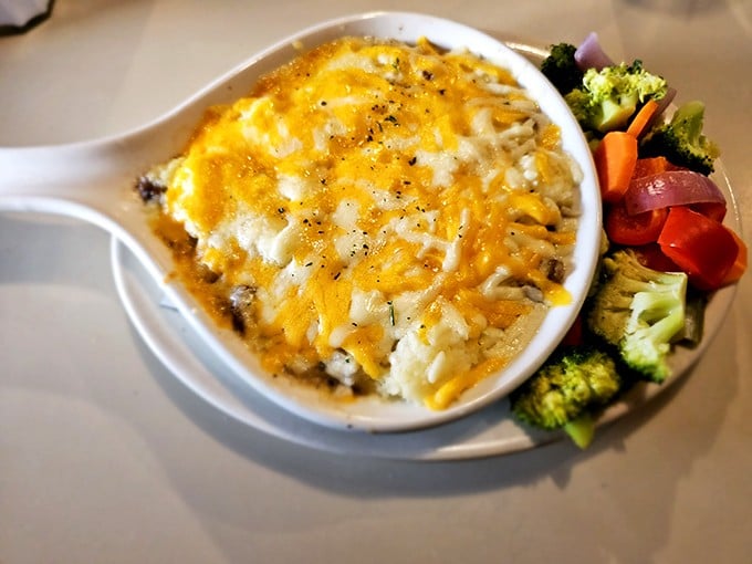 Shepherd's Pie that would make an Irish grandmother nod in approval, topped with melted cheese and served with colorful vegetables for that "yes, this is a complete meal" feeling.